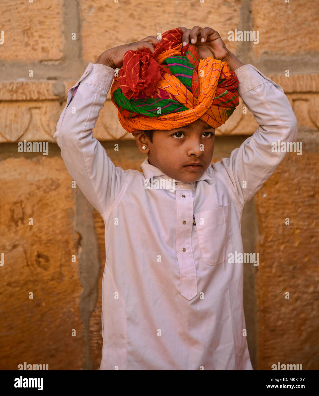 A boy putting on turbans, Jaisalmer, Rajasthan, India Stock Photo - Alamy