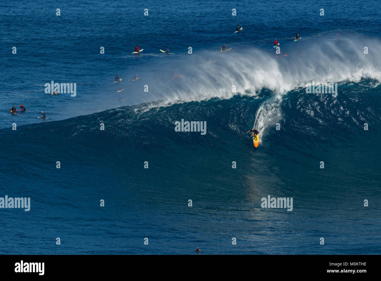 MAUI, HAWAII, USA-DECEMBER 10, 2014: Unknown surfer is riding a big ...