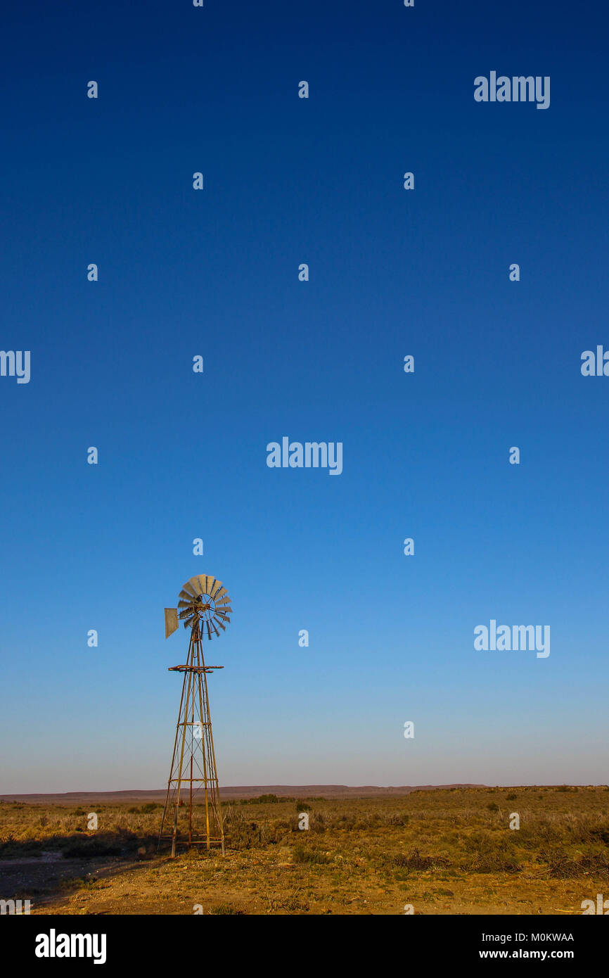 Karoo South Africa landscape with blue sky, a windmill and wide open ...