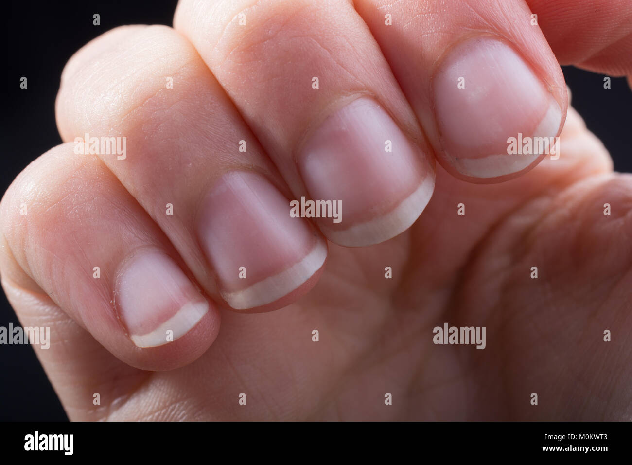 Four fingers of a child hand partly seen in black background Stock ...