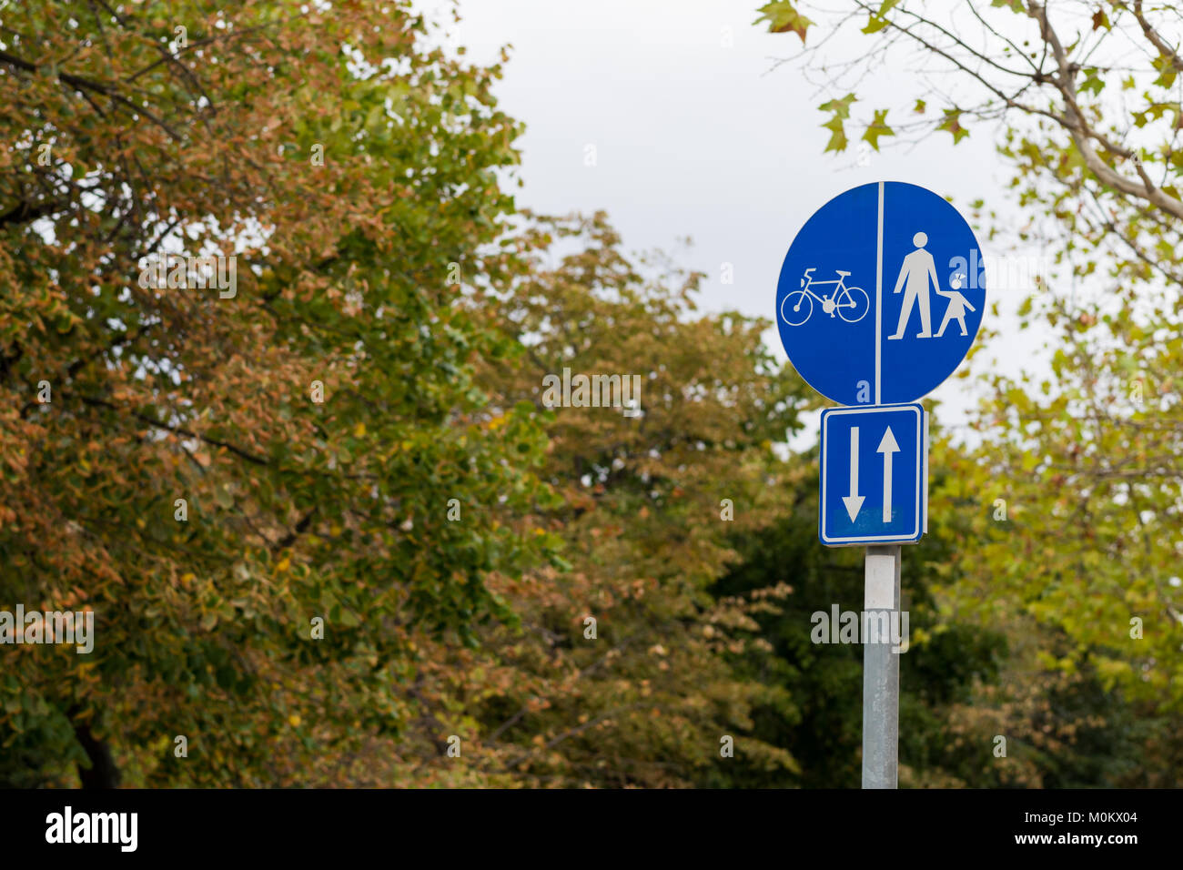 Blue traffic signs for bicycle and pedestrian zone Stock Photo - Alamy