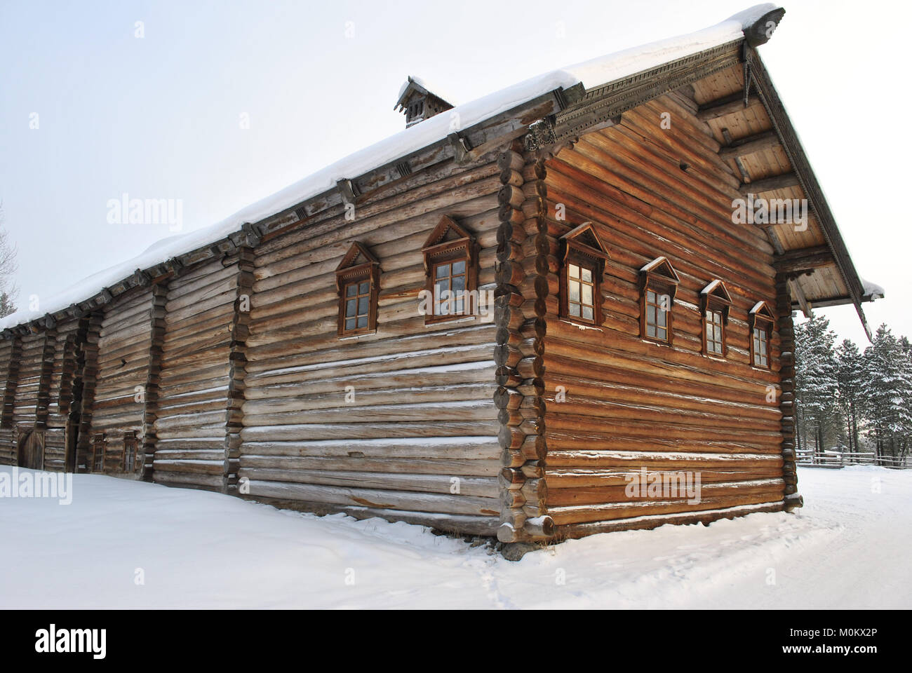 Traditional northern Russian wooden house made of round logs. Winter in ...