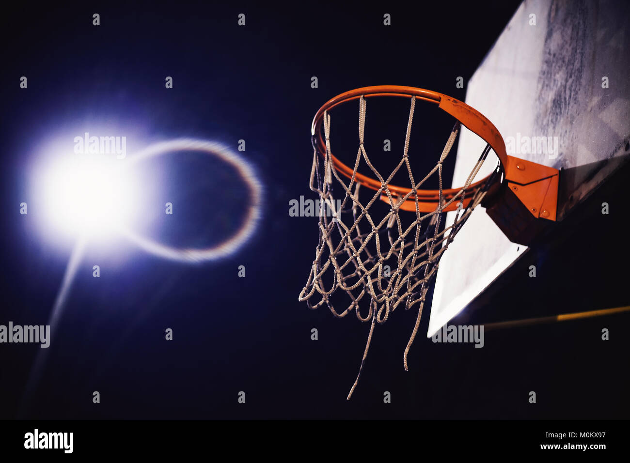 Closeup view of basketball hoop by night Stock Photo - Alamy