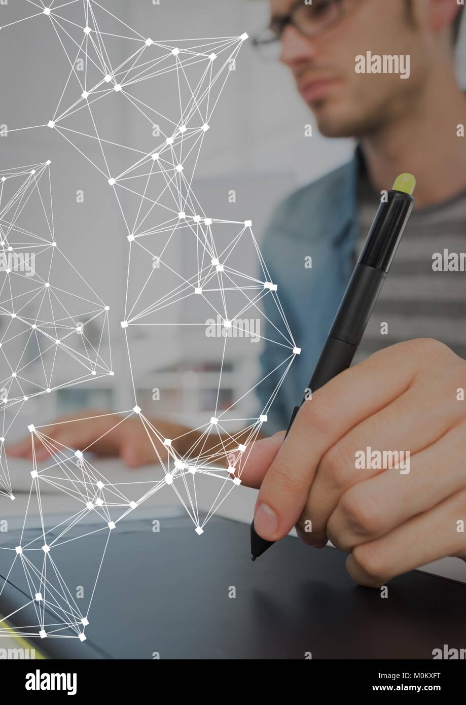 Business man using graphic tablet with graph overlays Stock Photo - Alamy