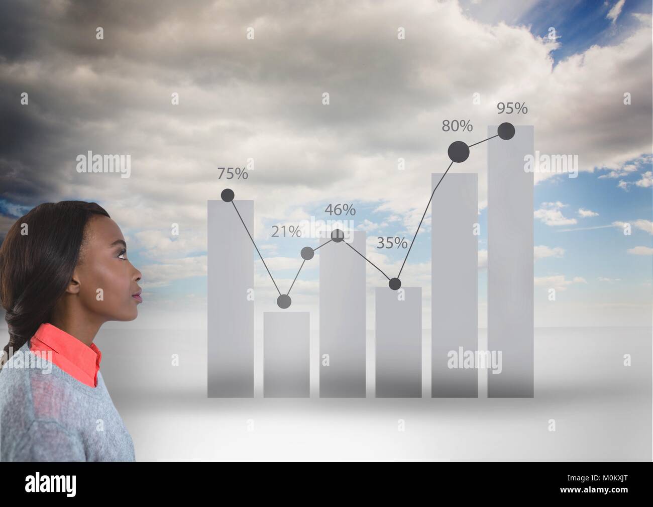 Woman looking at graph Stock Photo - Alamy