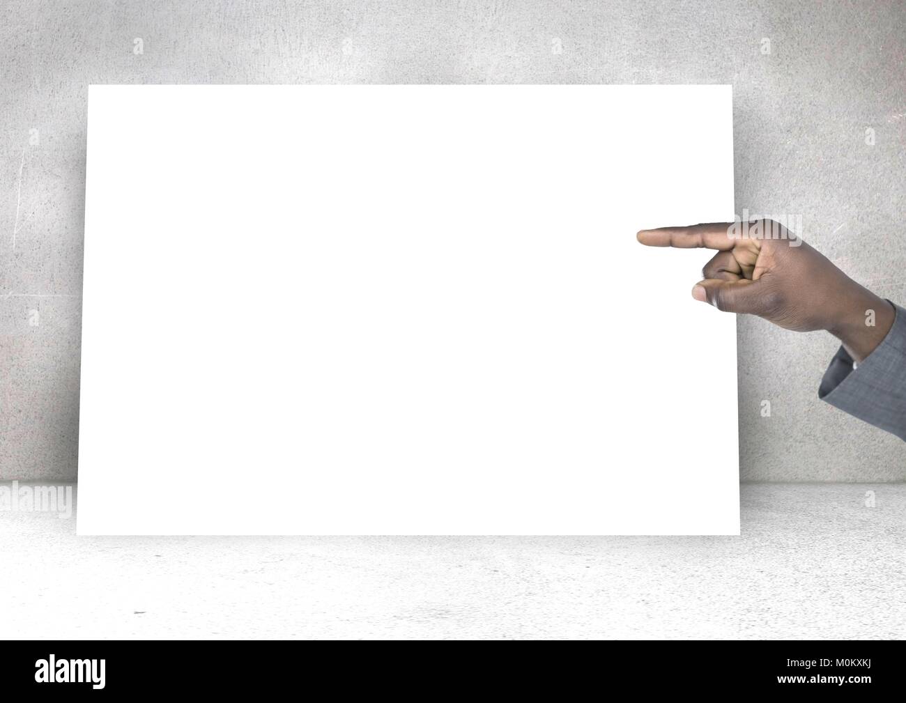 Hand pointing at whiteboard Stock Photo - Alamy