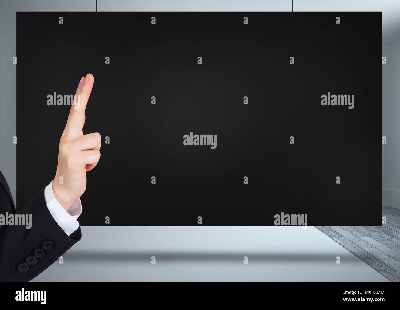 Hand pointing over black screen Stock Photo - Alamy