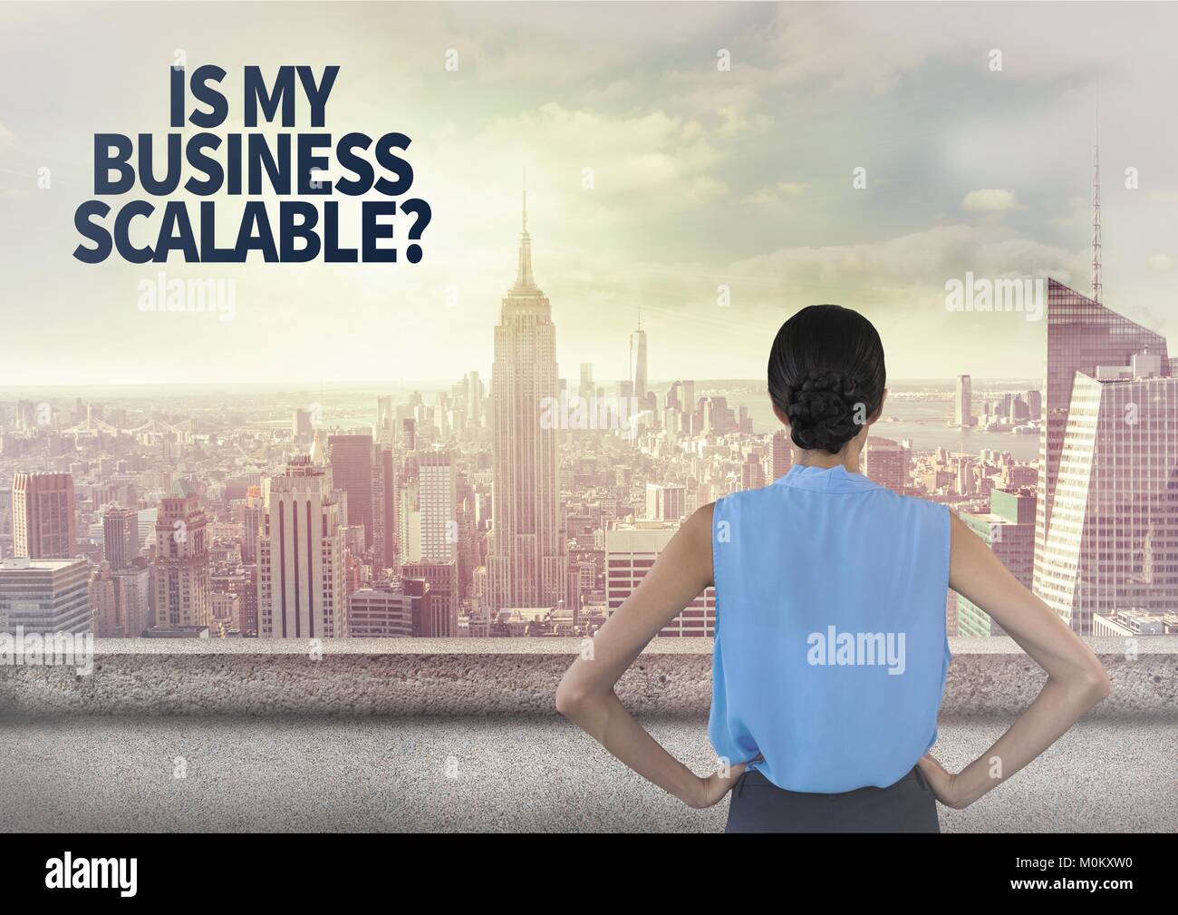 Woman looking out over city skyline with text in corner Stock Photo - Alamy
