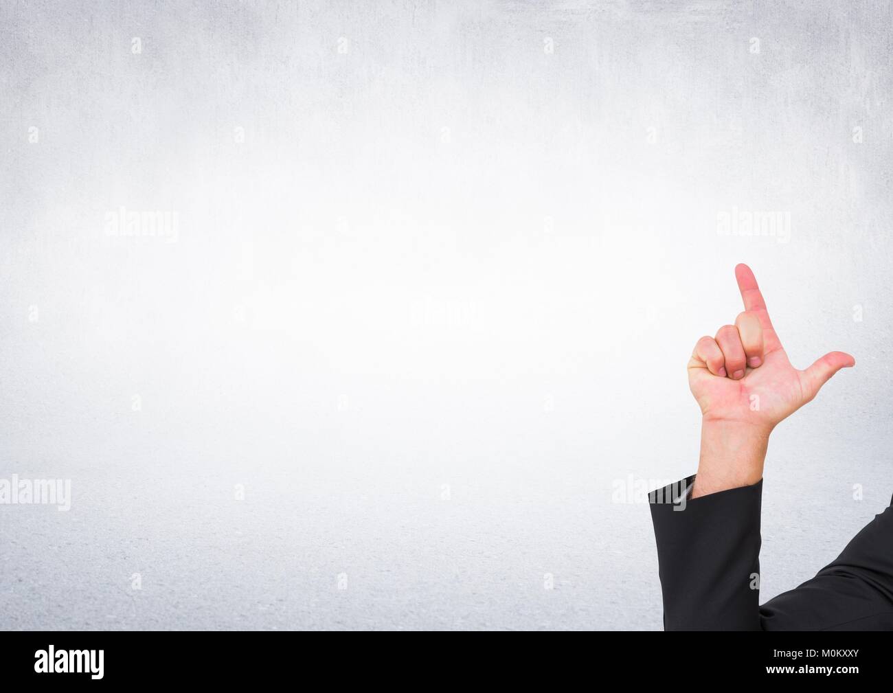 Hand pointing at bright background Stock Photo - Alamy
