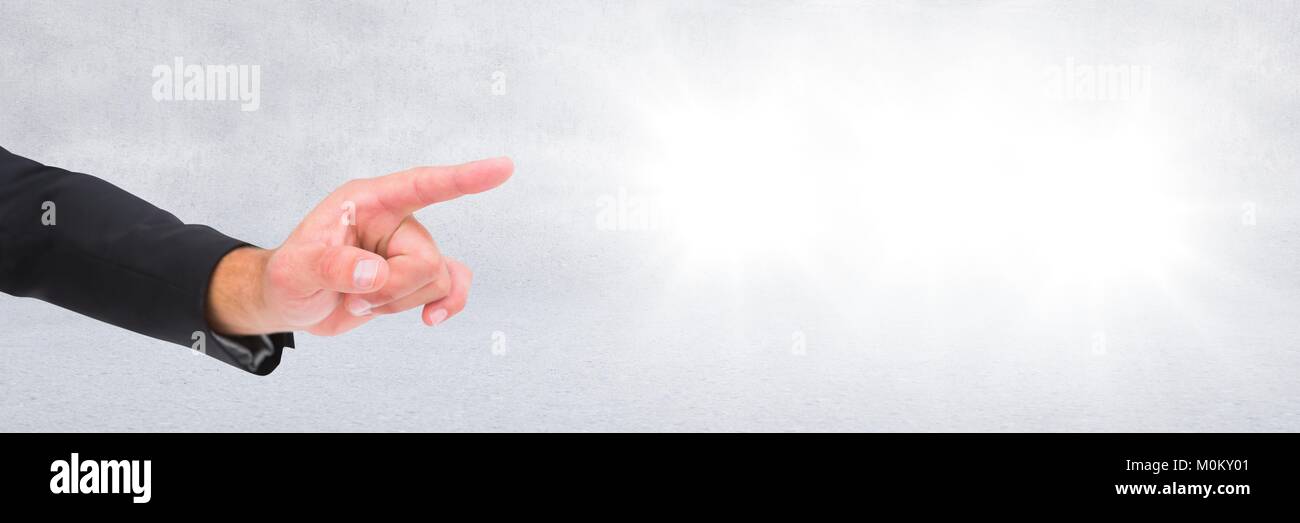 Hand pointing with bright background Stock Photo - Alamy