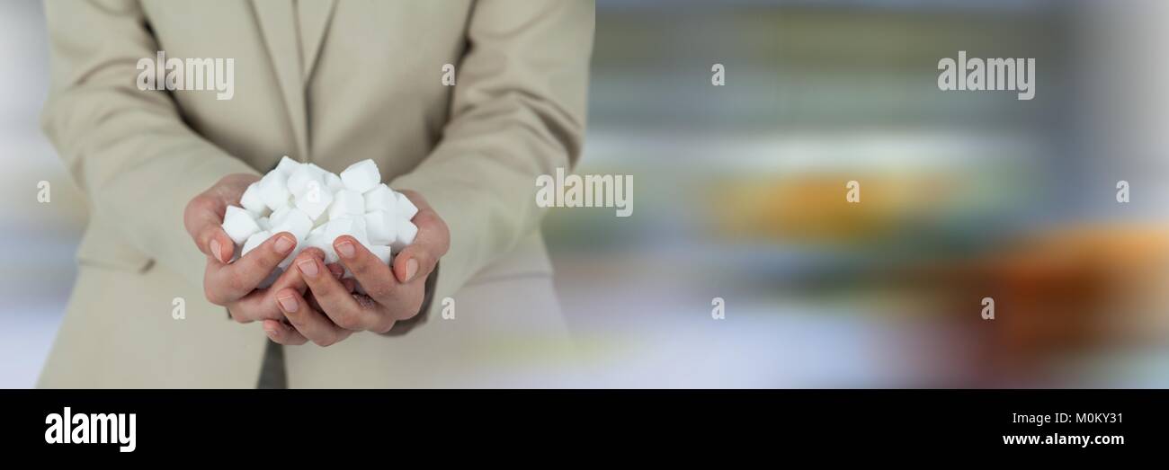 Sugar cubes in hands of business person Stock Photo - Alamy