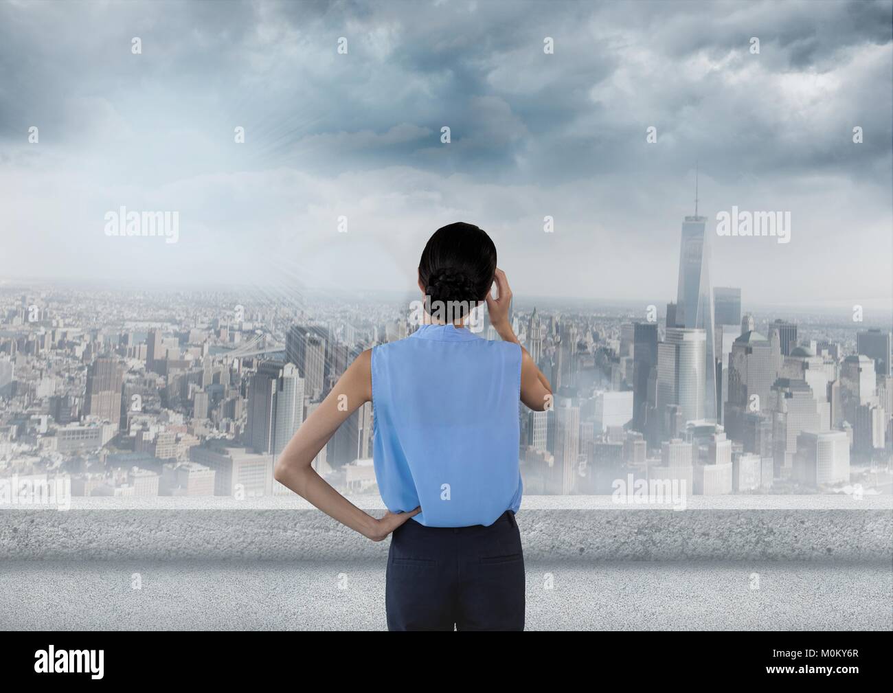 Business woman looking over skyline Stock Photo - Alamy