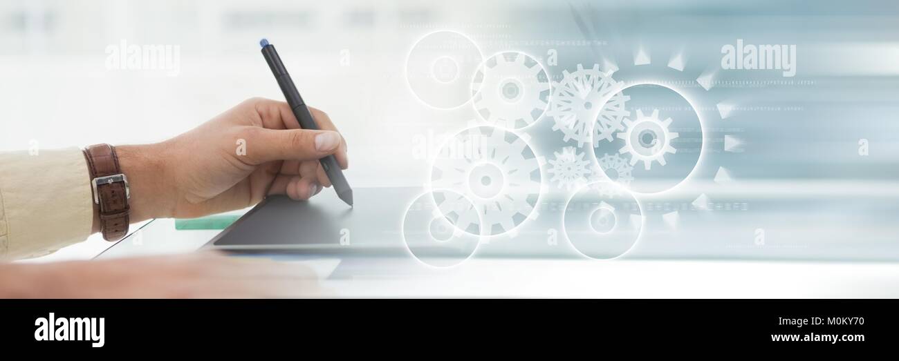 Hand using graphic tablet with graph overlays Stock Photo - Alamy