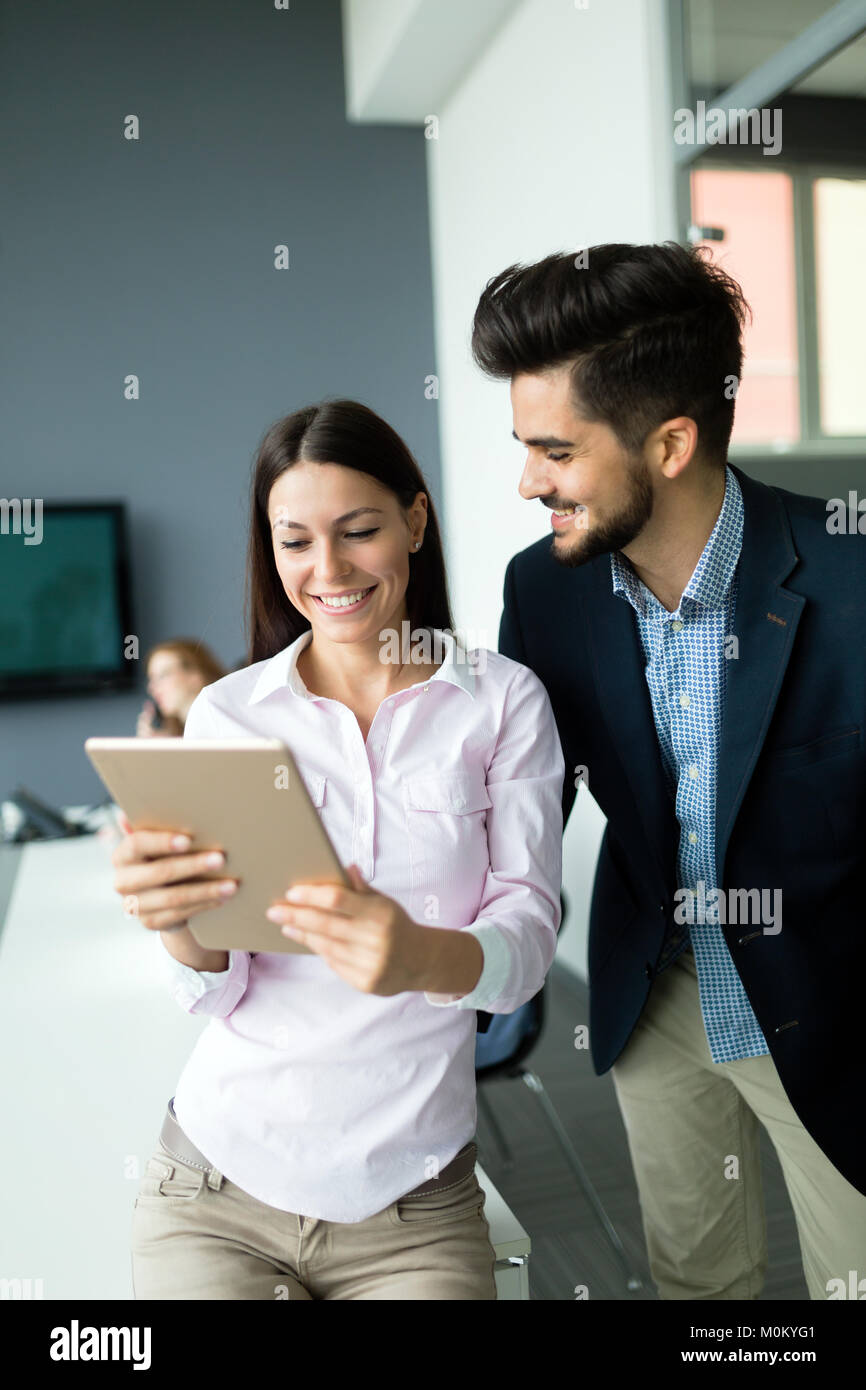 Happy business colleagues in modern office Stock Photo - Alamy