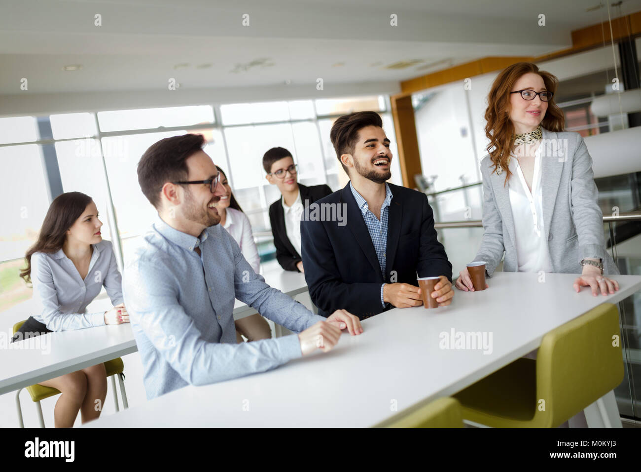 Business colleagues having conversation during coffee break Stock Photo ...