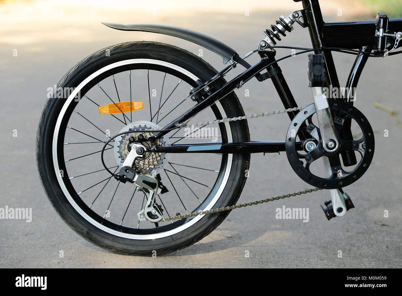 Folding bike on road Stock Photo - Alamy
