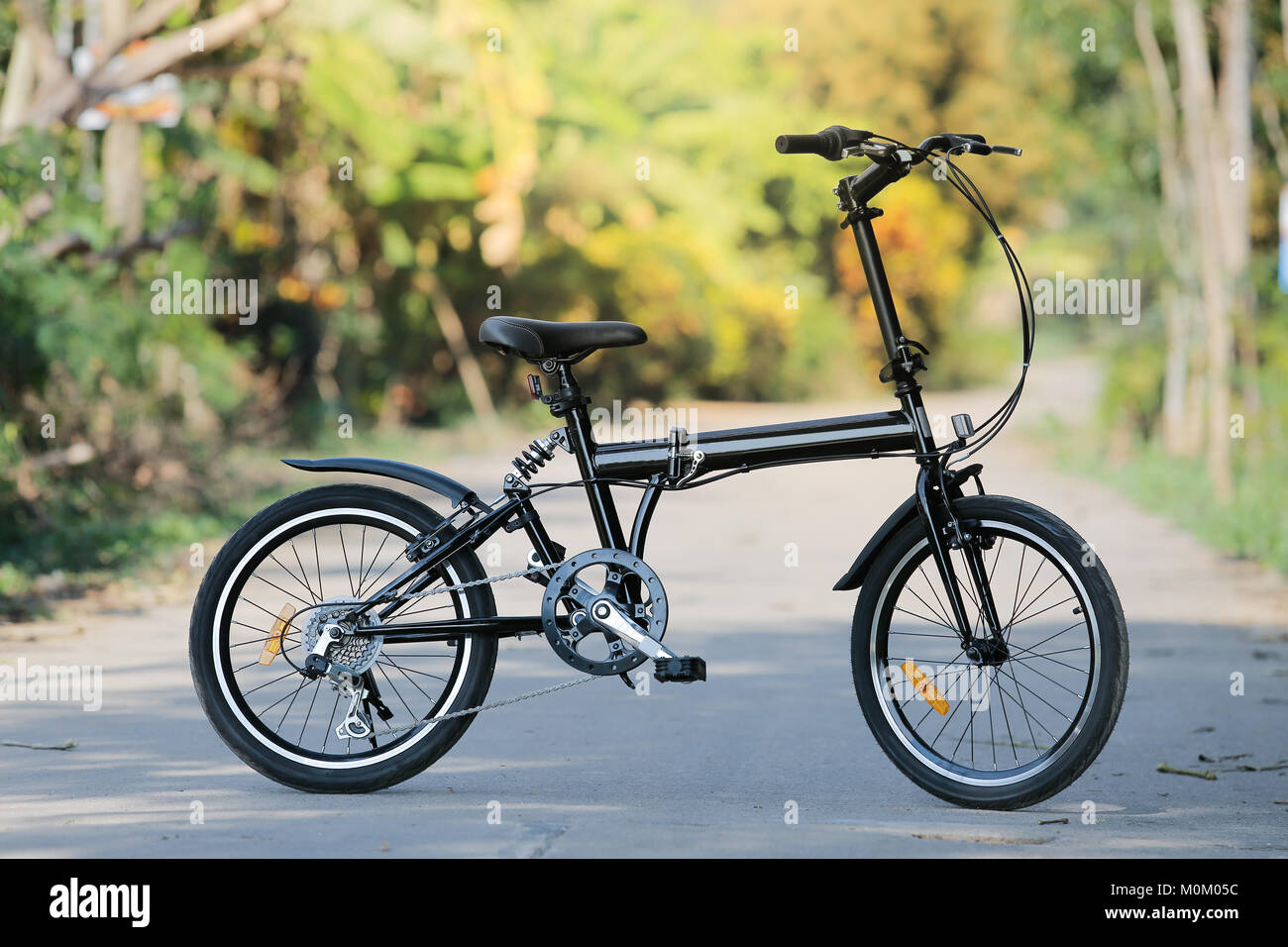 Folding bike on road Stock Photo - Alamy