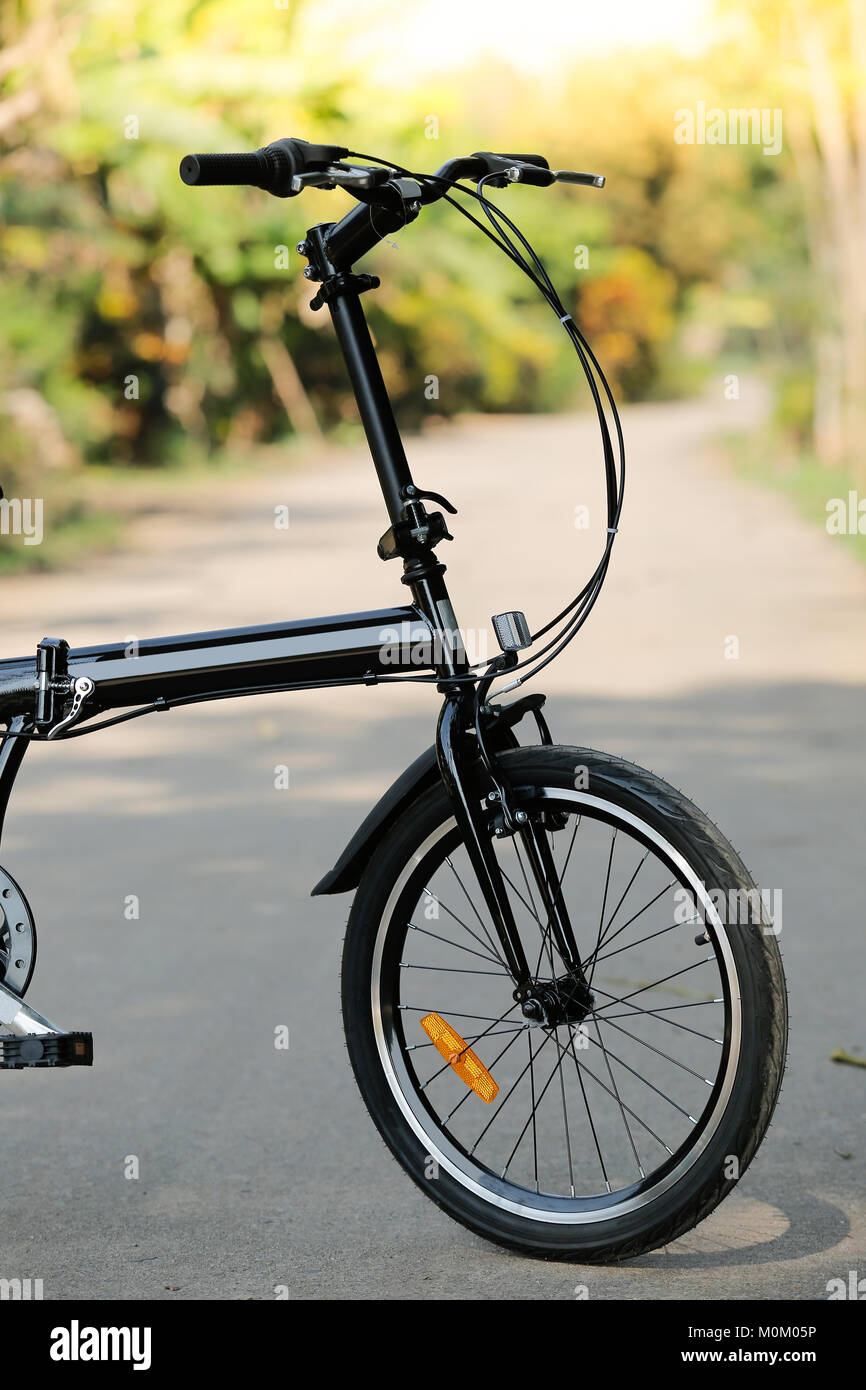 Folding bike on road Stock Photo - Alamy