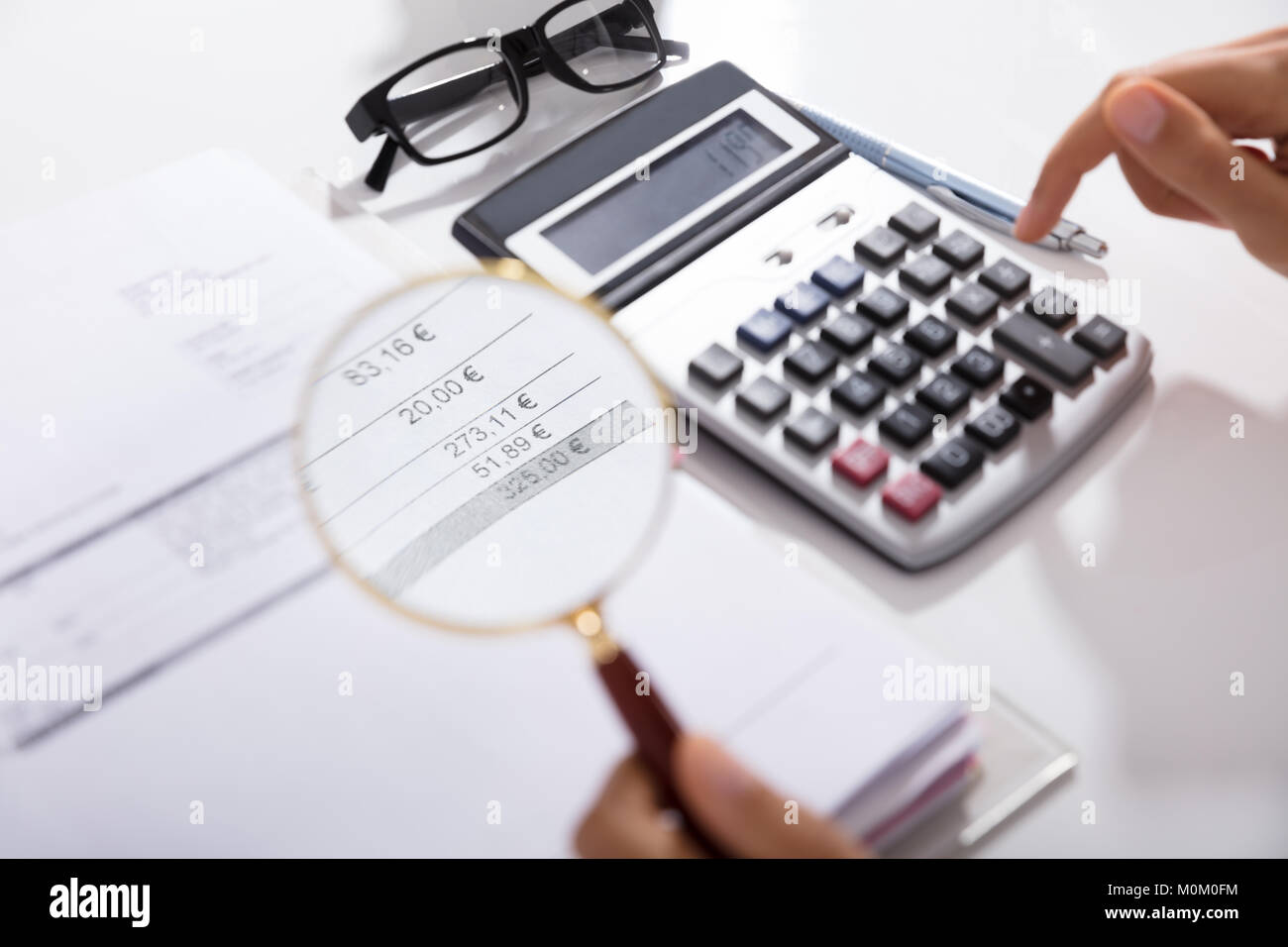 Photo Of Businesswoman Analyzing Invoice With Magnifying Glass Stock ...