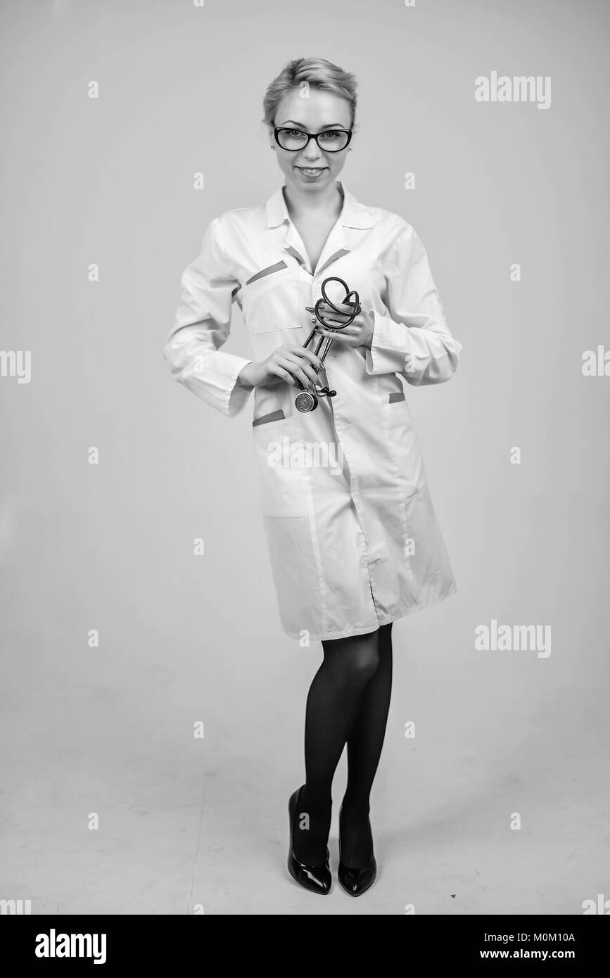 Doctor in his medical office at work black and white poster Stock Photo ...