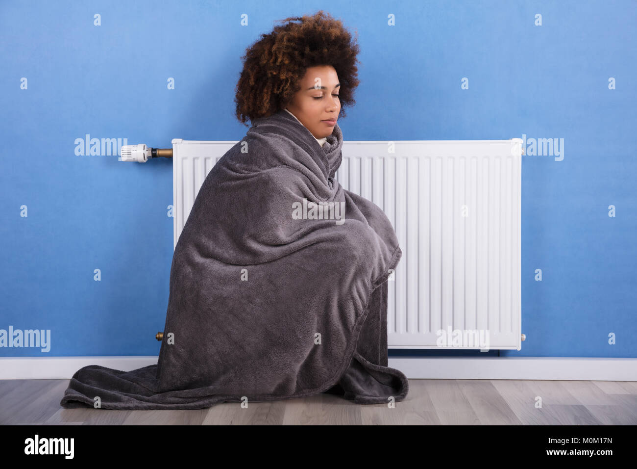 Black woman wrapped in blanket hi-res stock photography and images - Alamy