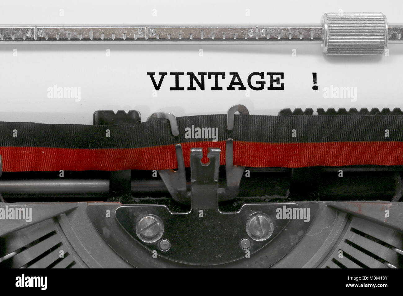 VINTAGE written by the old typewriter on white sheet Stock Photo - Alamy