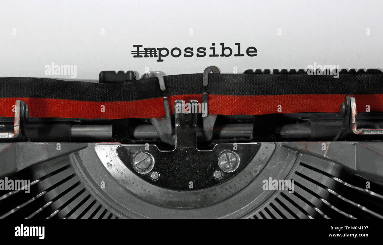 Impossible word on typewriter close hi-res stock photography and images ...