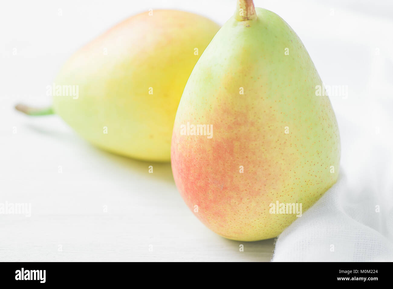 Couple of Ripe Organic Pears in Pastel Green Yellow Red Colors on White ...