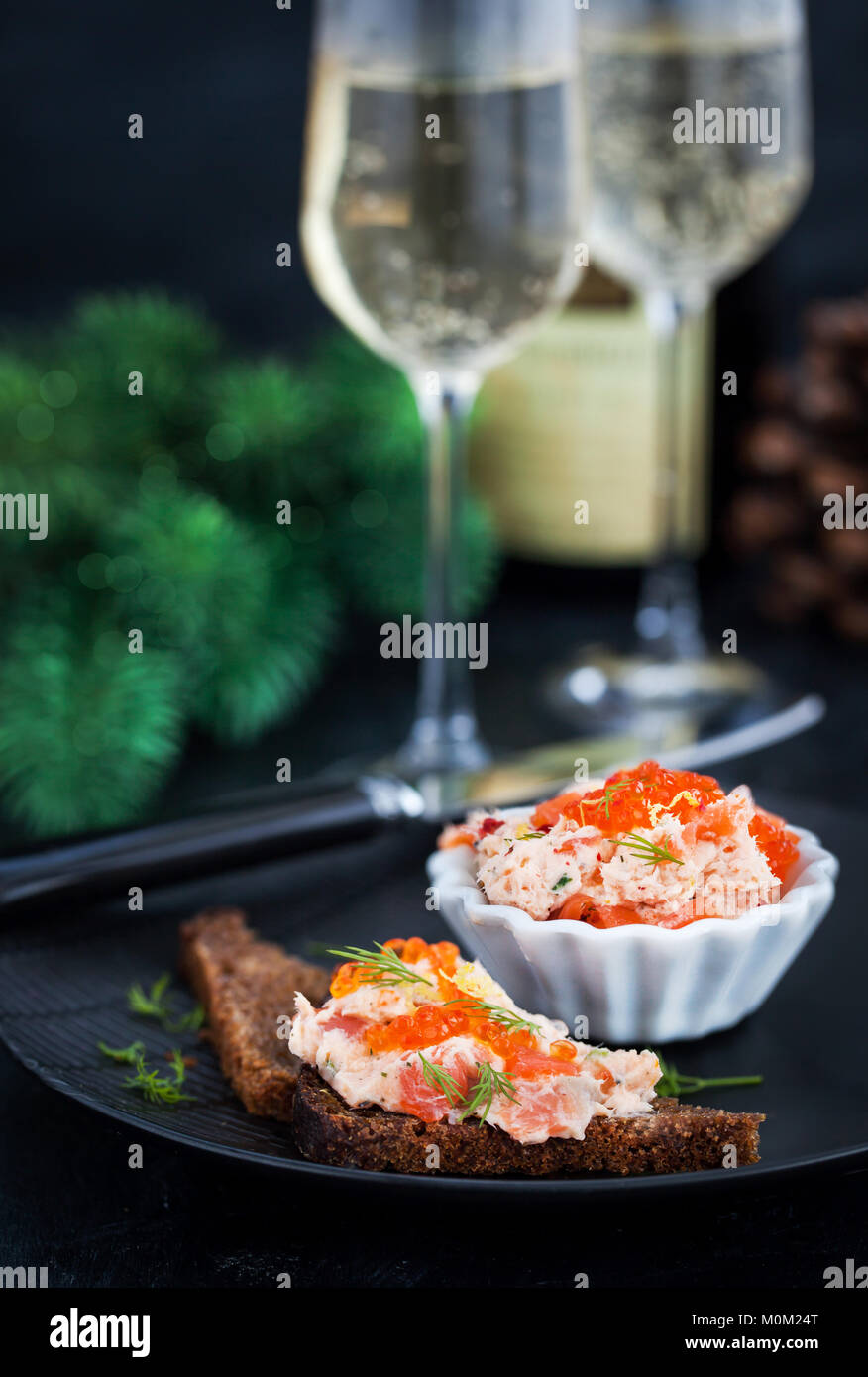 Salmon pate (rillettes) with red caviar served with sliced bread Stock ...