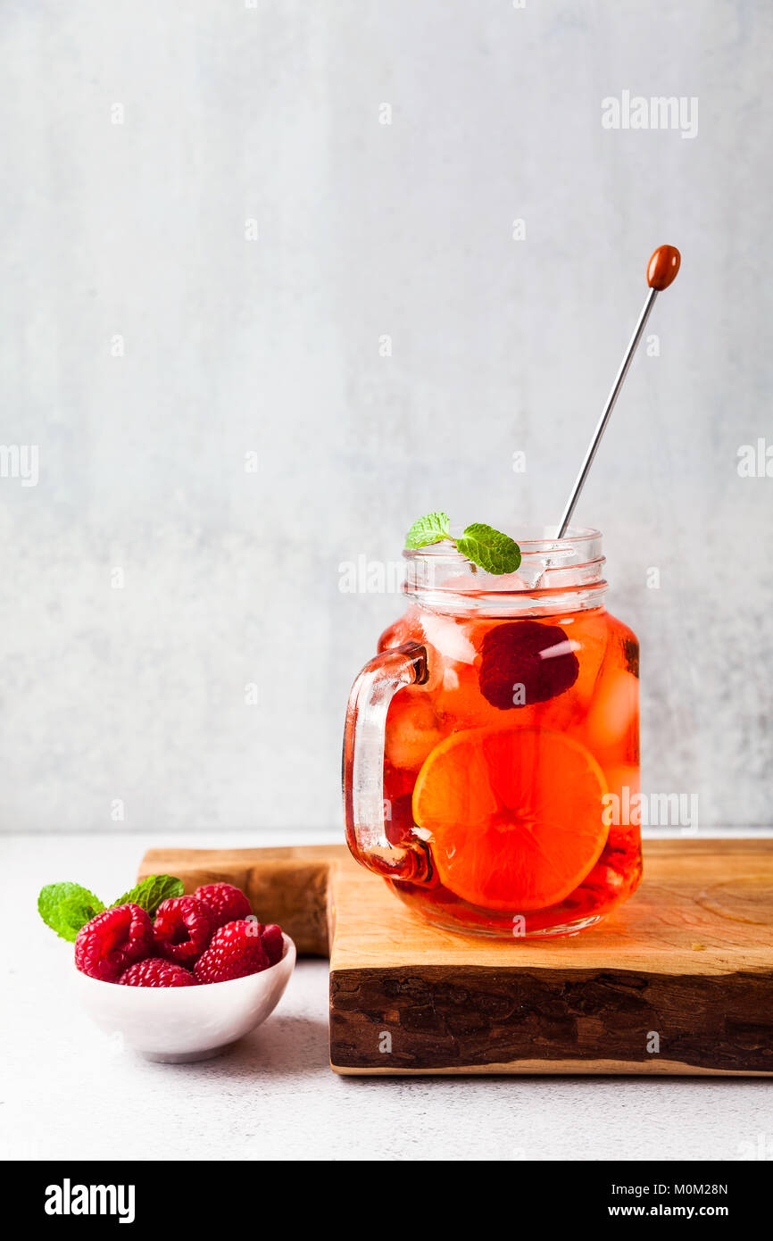 summer refreshing drink with ice and fresh ripe berries. raspberries ...