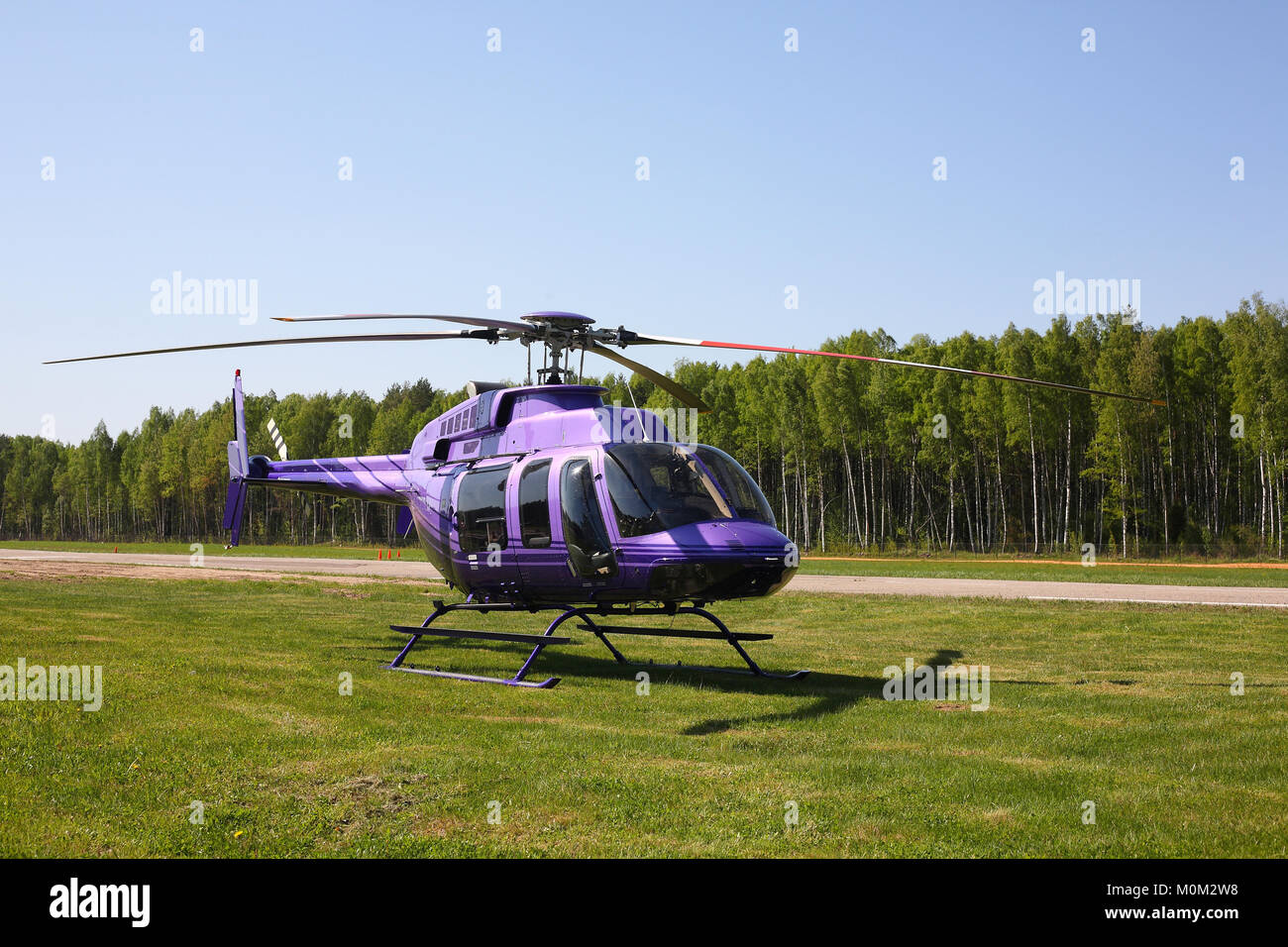 Aircraft purple helicopter on parking hi-res stock photography and ...