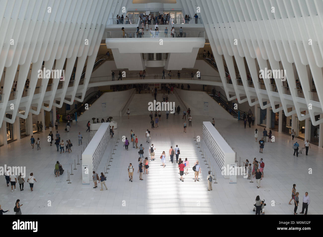 People walk through the open space of the Oculus at World Trade Center ...