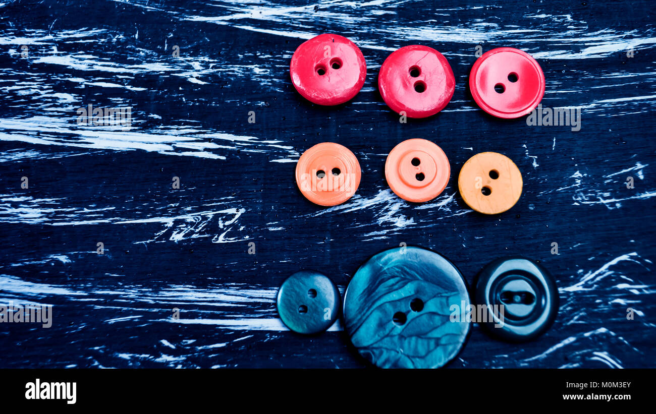 Buttons for clothing and sewing on the table Stock Photo - Alamy