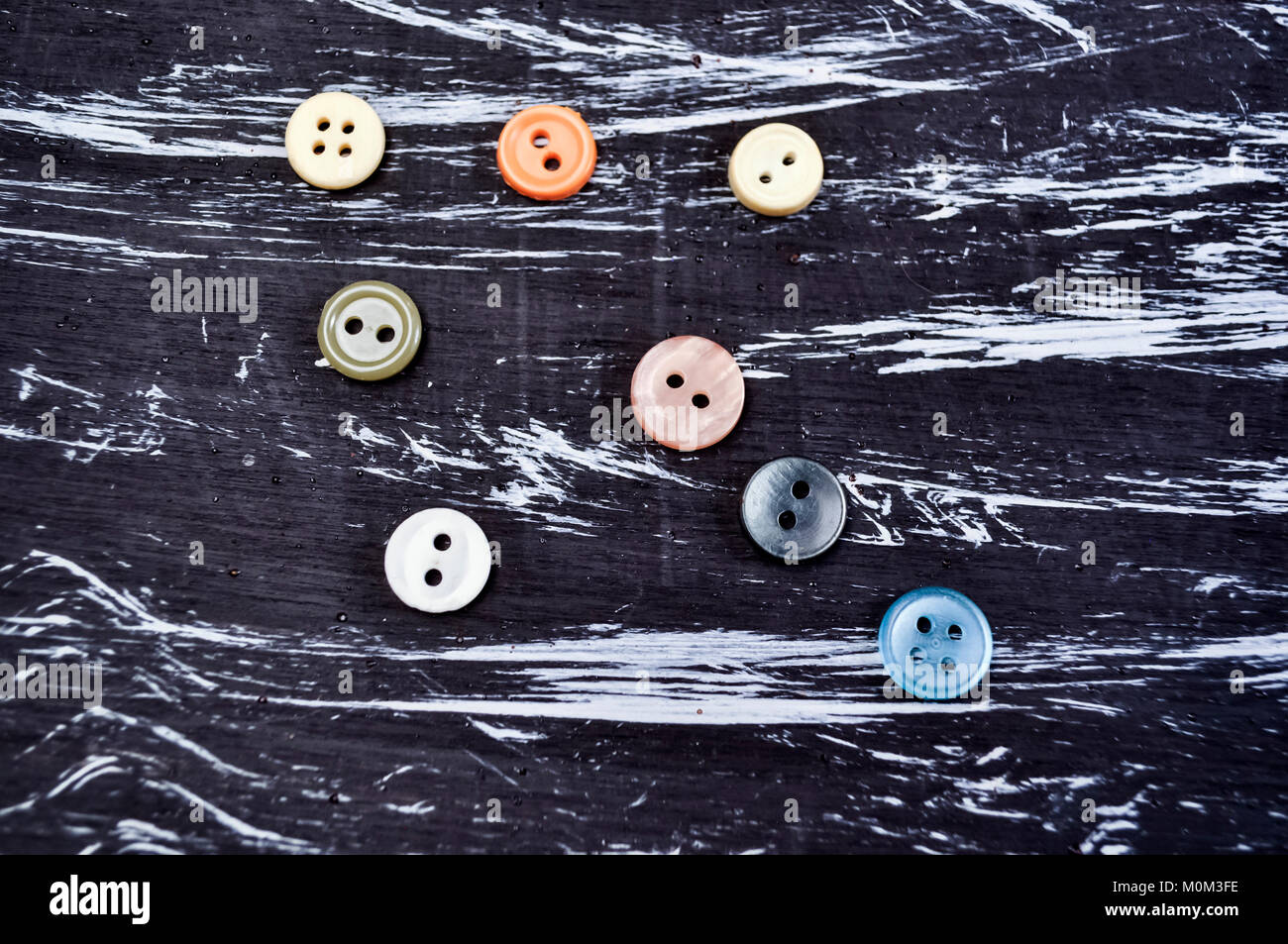 Buttons for clothing and sewing on the table Stock Photo - Alamy