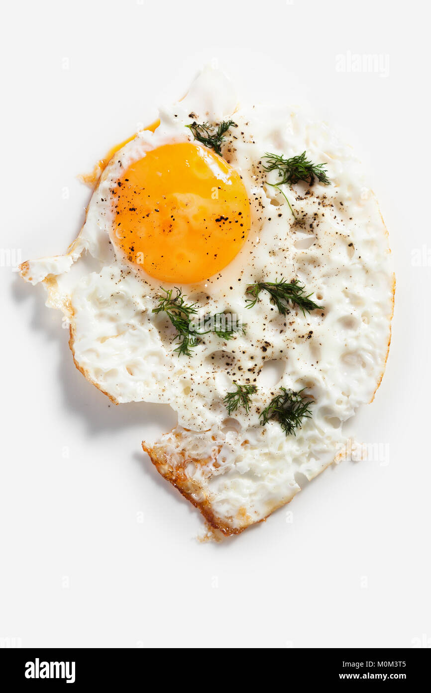 Natural fried egg on white background closeup Stock Photo - Alamy