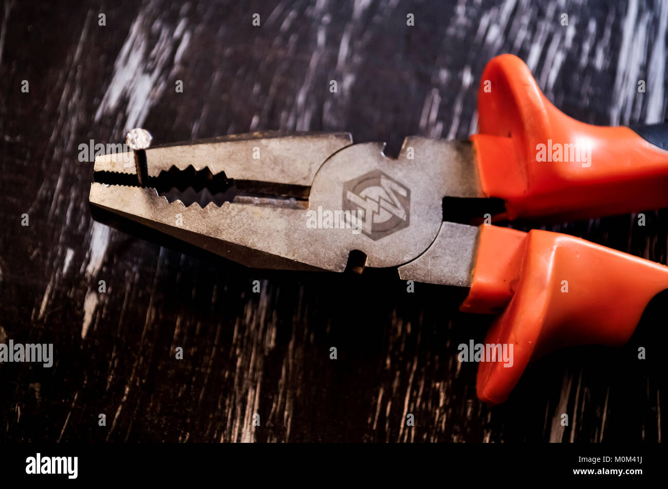 Pliers for repair work lying on the table Stock Photo - Alamy
