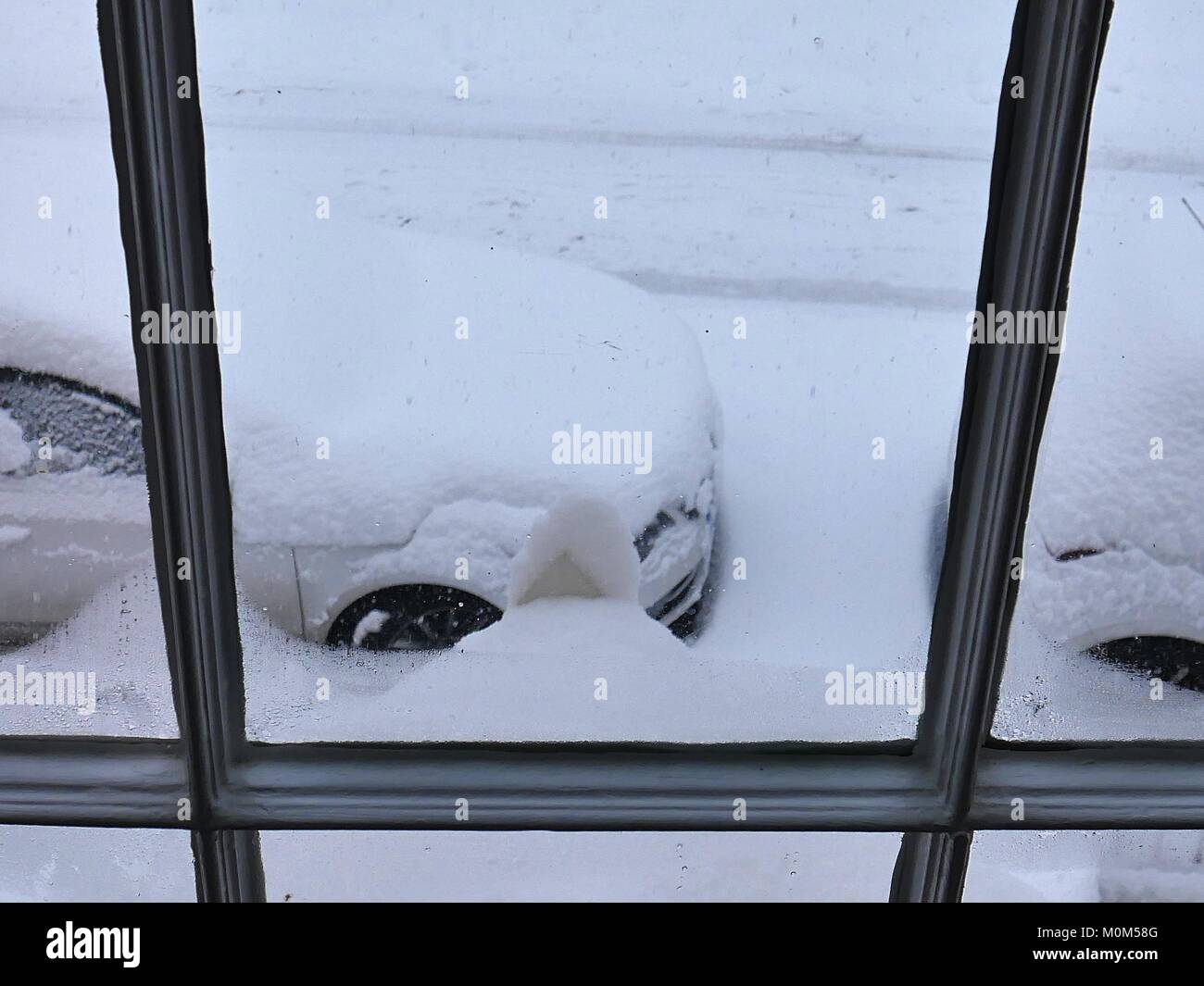Looking out of window at deep snow covering cars, Malvern UK Stock ...