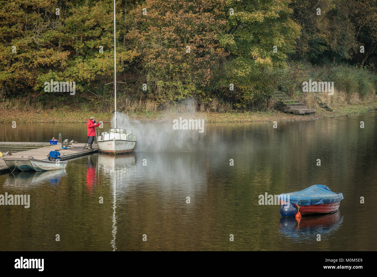 Man wash the boat at Rudyard in Leek Stock Photo - Alamy