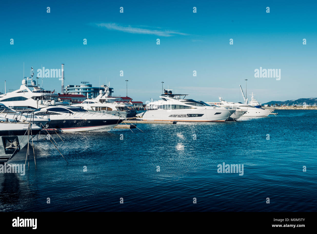 Sailing yachts and private boats at pier in Sochi seaport. yachts in ...