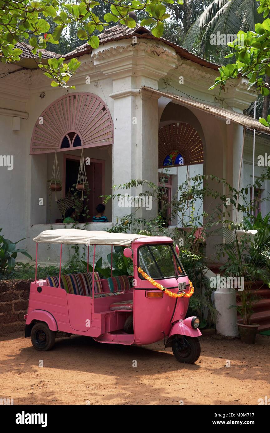 India,Goa,pink rickshaw parked in front of a colonial portuguese house ...
