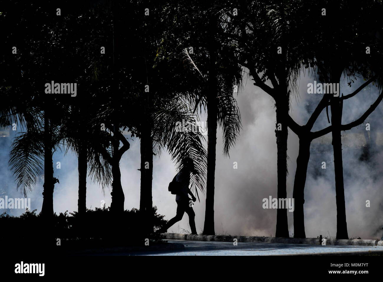 Caracas, Venezuela. 22nd Jan, 2018. A protester seen taking cover ...