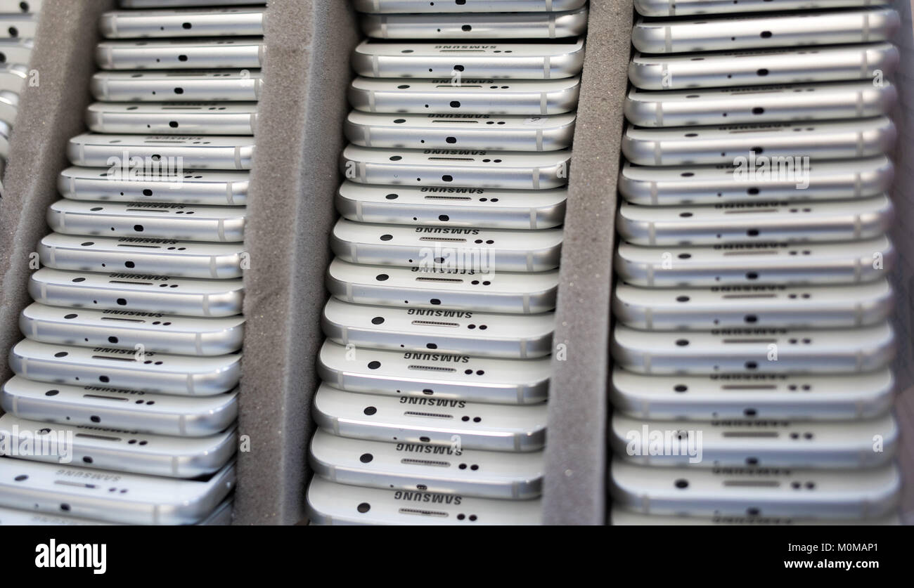 Darmstadt, Germany. 1st Dec, 2017. Dozens of mobile phones are stacked ...