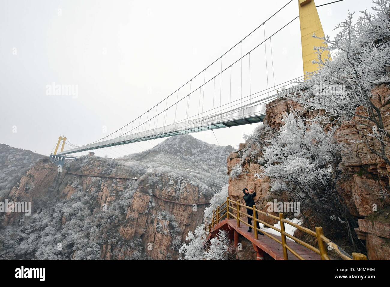 Pingdingshan, China's Henan Province. 23rd Jan, 2018. A tourist enjoys ...