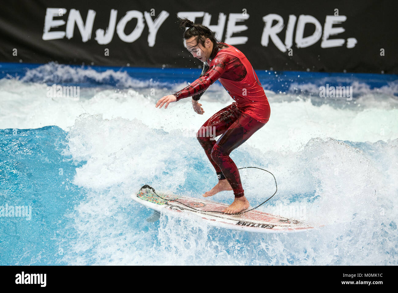 Duesseldorf, Germany. 19th Jan, 2018. A surfer shows off his skills on ...