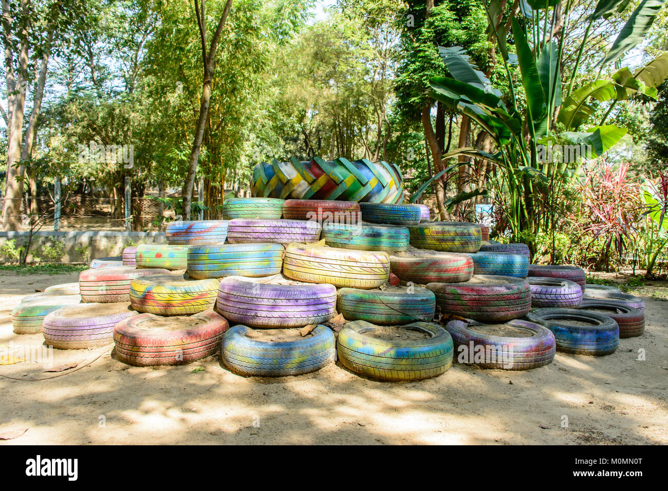 photo of old tyre, paint and reuse in the park Stock Photo - Alamy