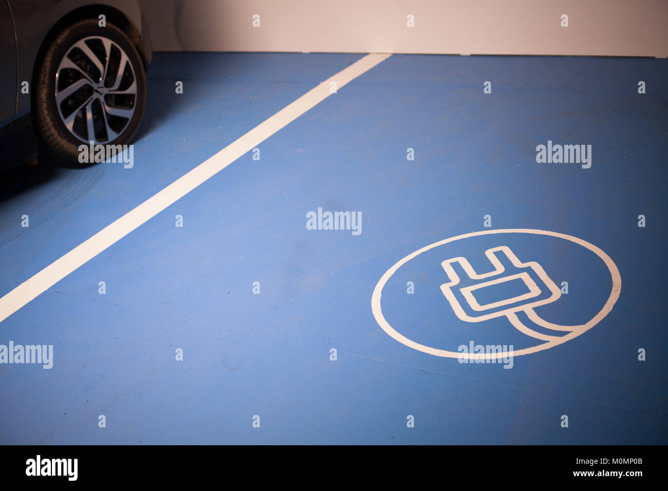Electric charging point and parking space with painted charging hi-res ...