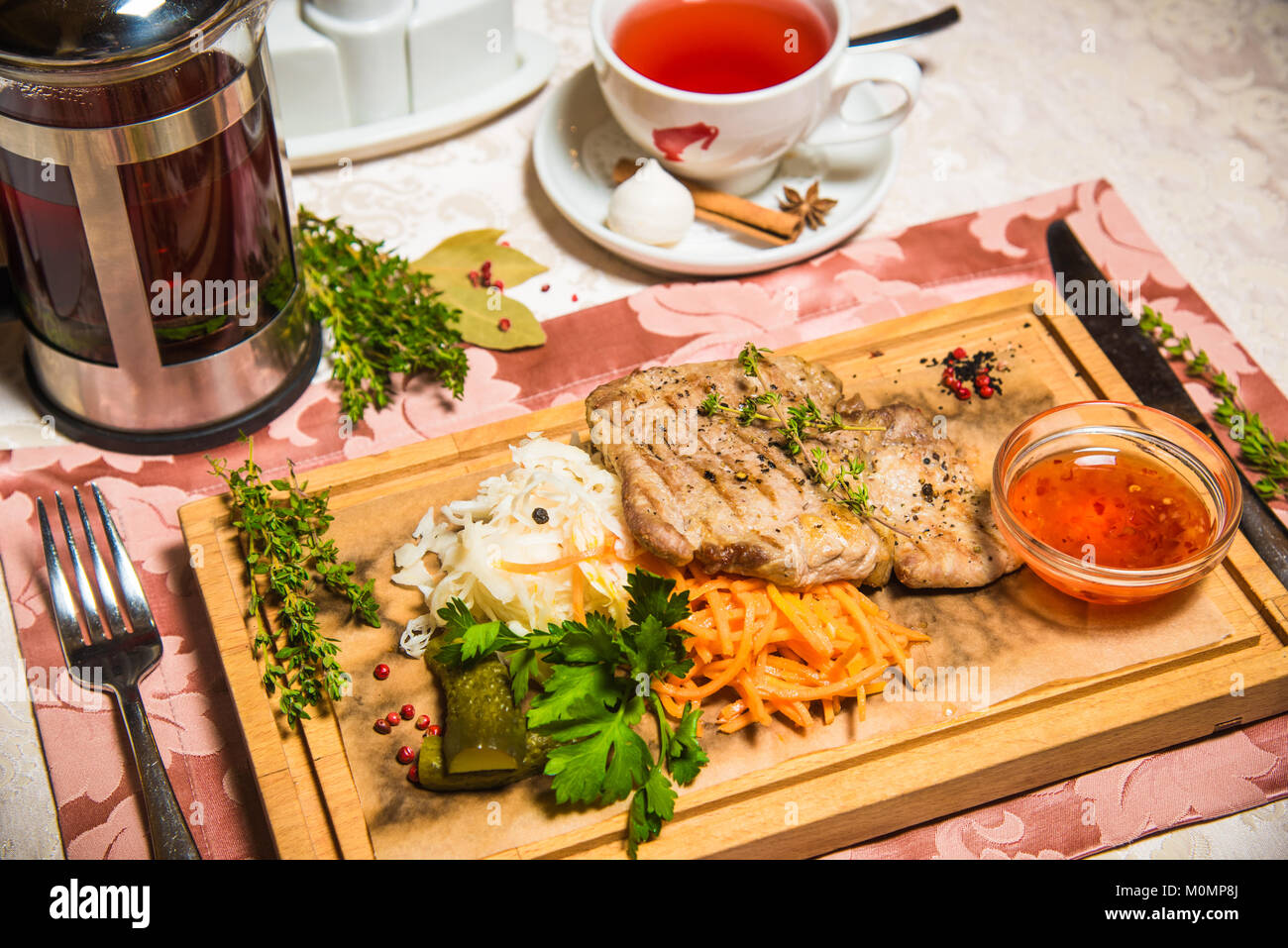 Chef s specialty presented in restaurant on decorated table Stock Photo ...