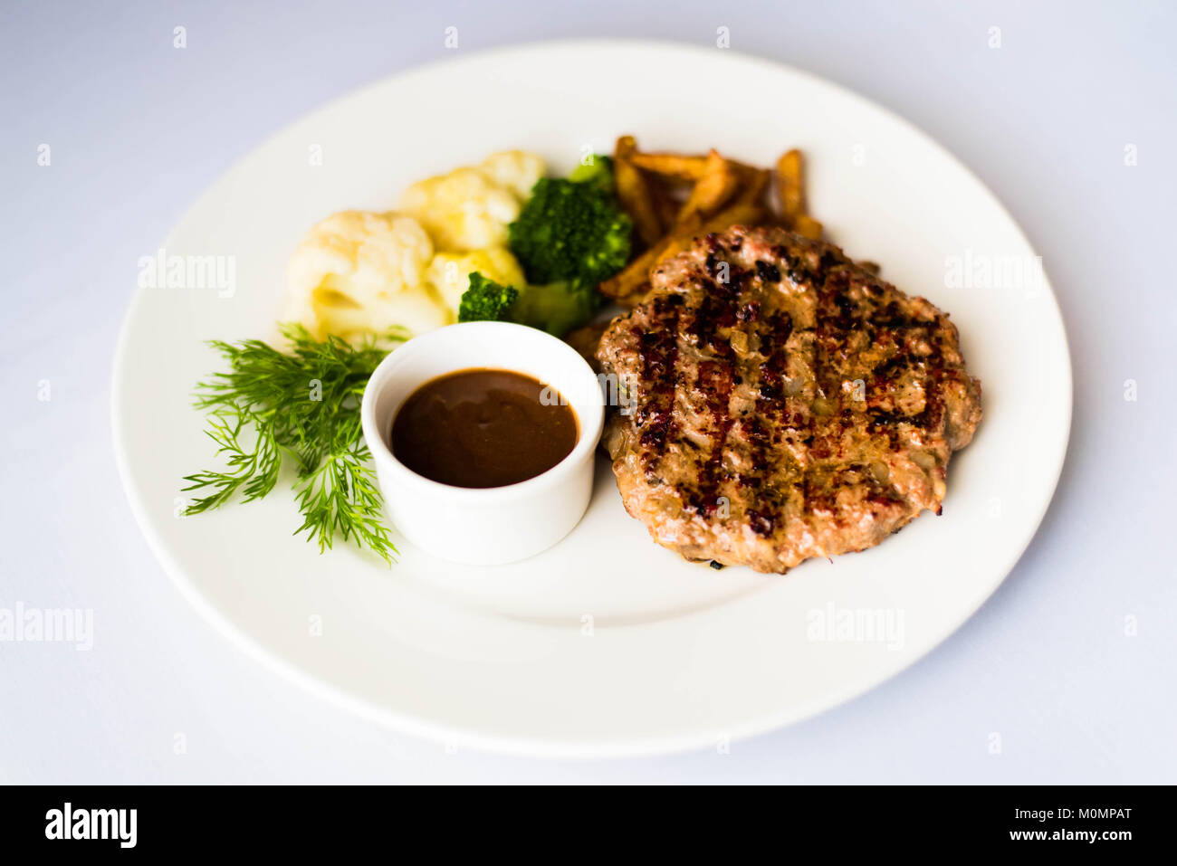 Chef s specialty presented in restaurant on decorated table Stock Photo ...