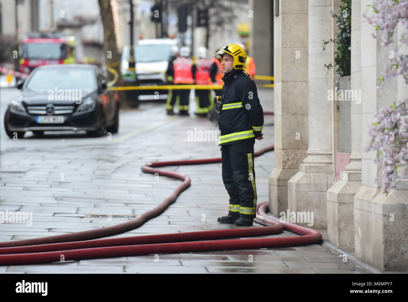 Firefighters behind hi-res stock photography and images - Alamy