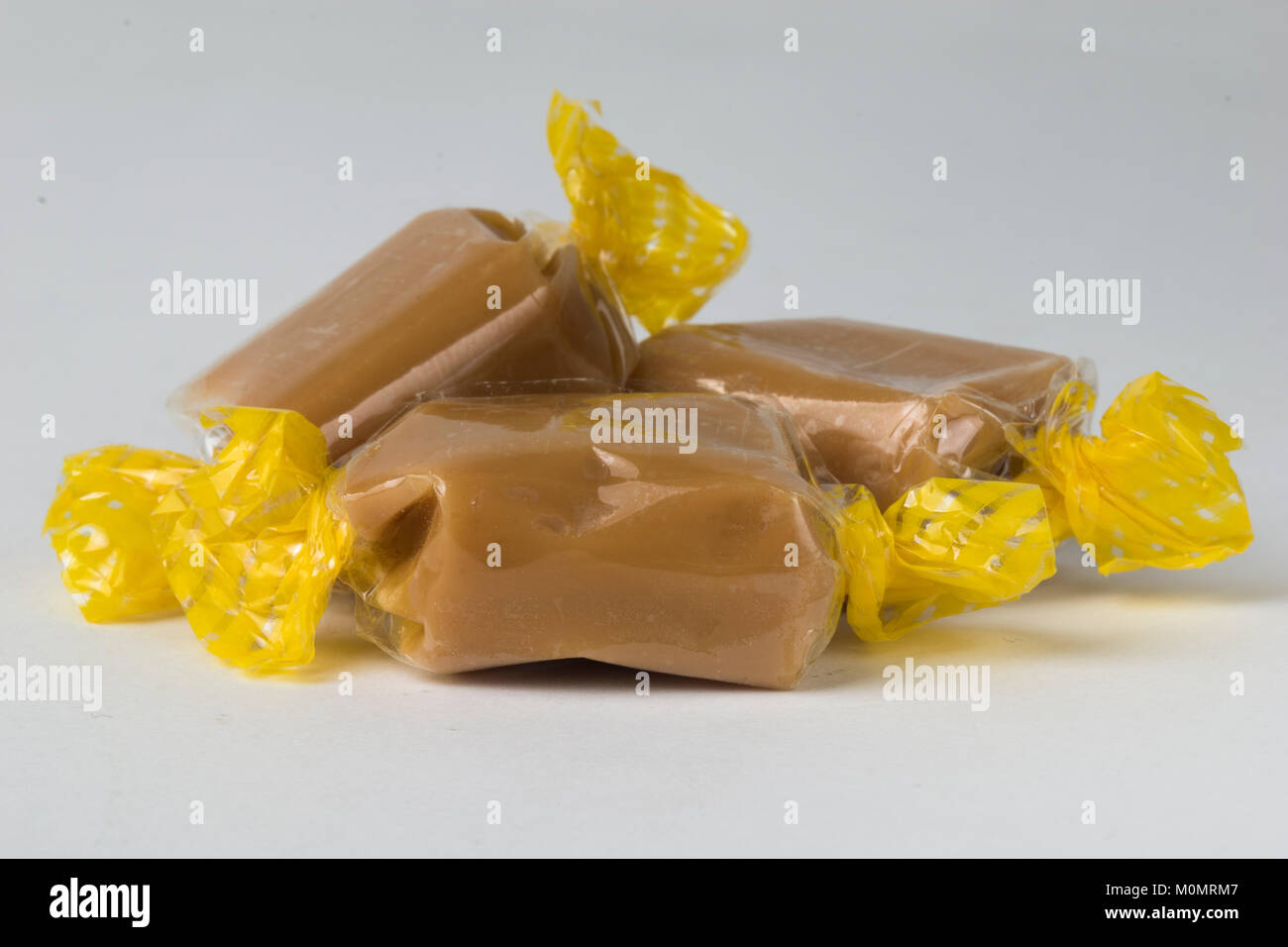 Toffee in clear wrapper's Stock Photo - Alamy